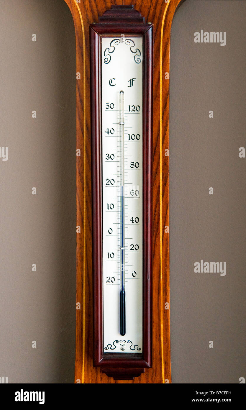 Thermometer in fancy wood housing Stock Photo - Alamy