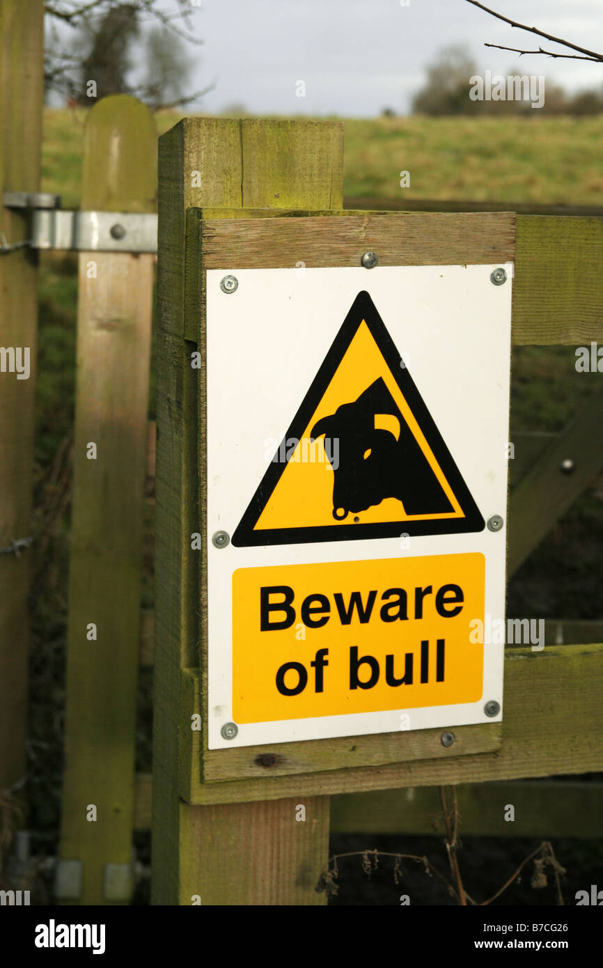 Countryside stile, fence, beware of bull, sign, farmers field, gate to ...