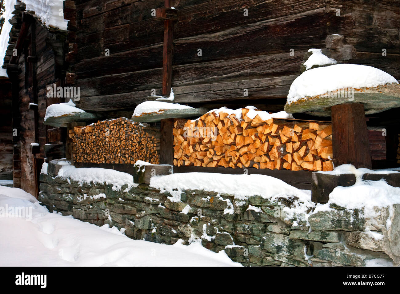 Fire wood stacked for winter in Zermatt Switzerland Stock Photo - Alamy