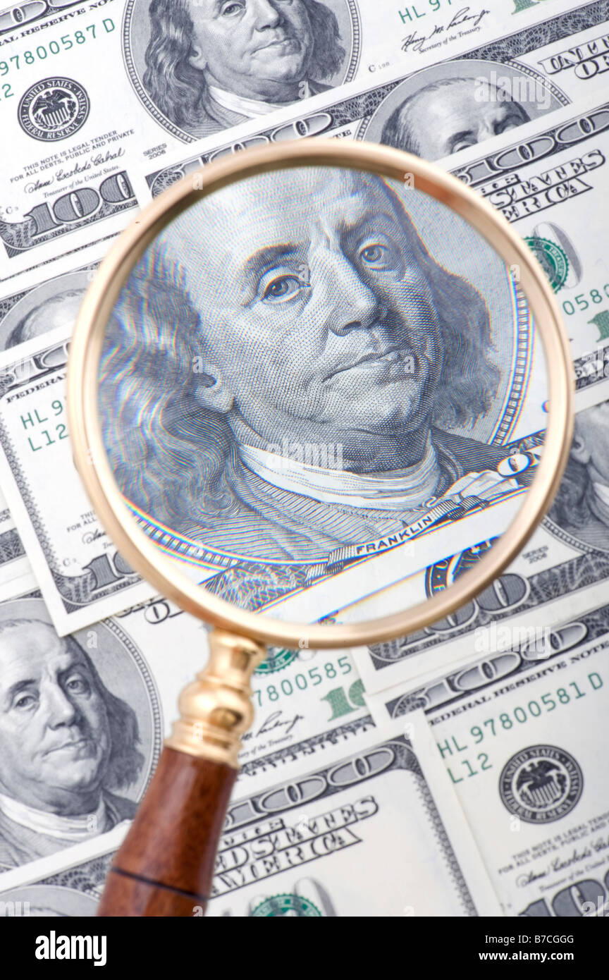 object on white currency magnifying glass with money Stock Photo - Alamy
