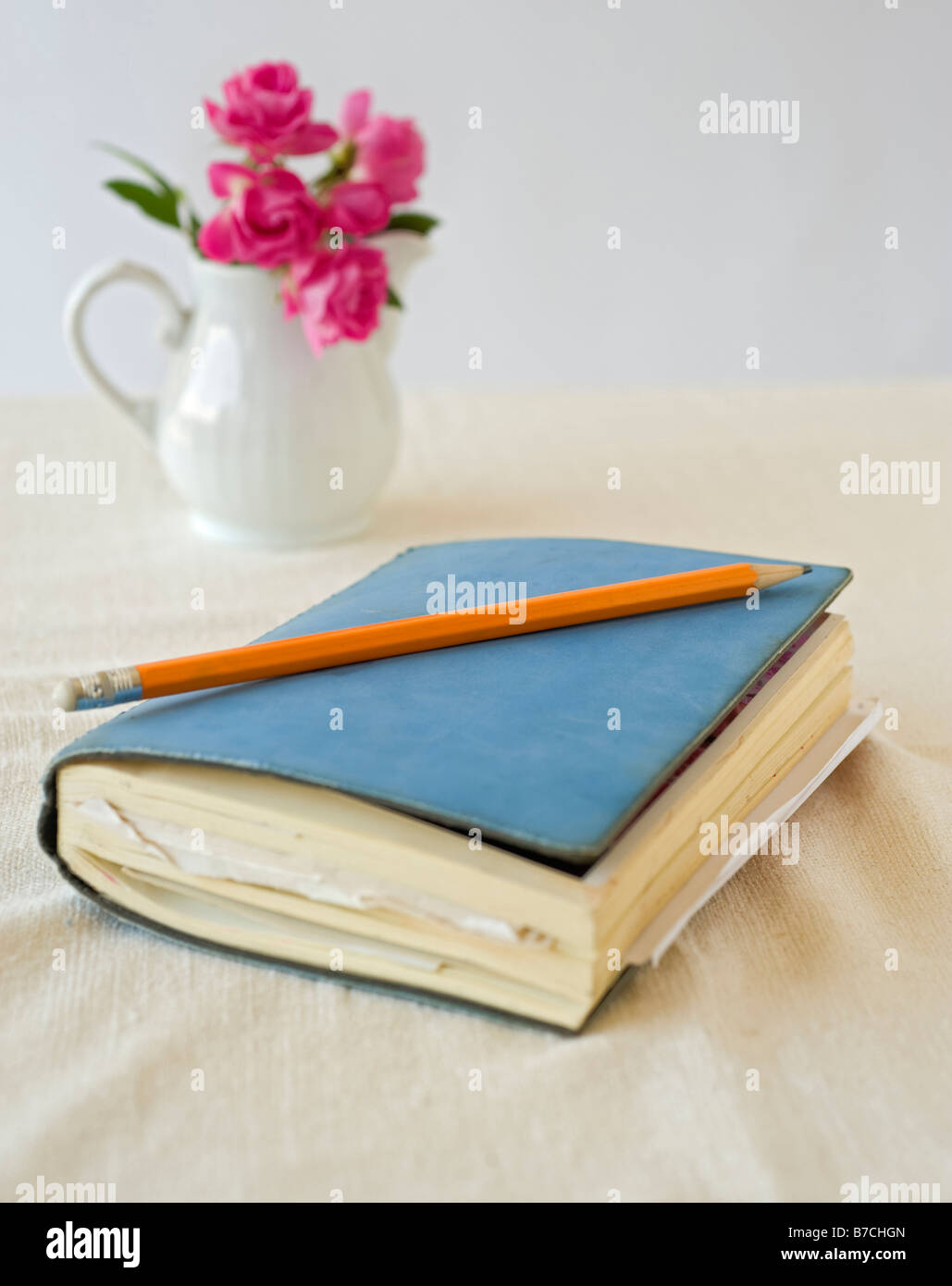 closed scrapbook and pencil Stock Photo - Alamy
