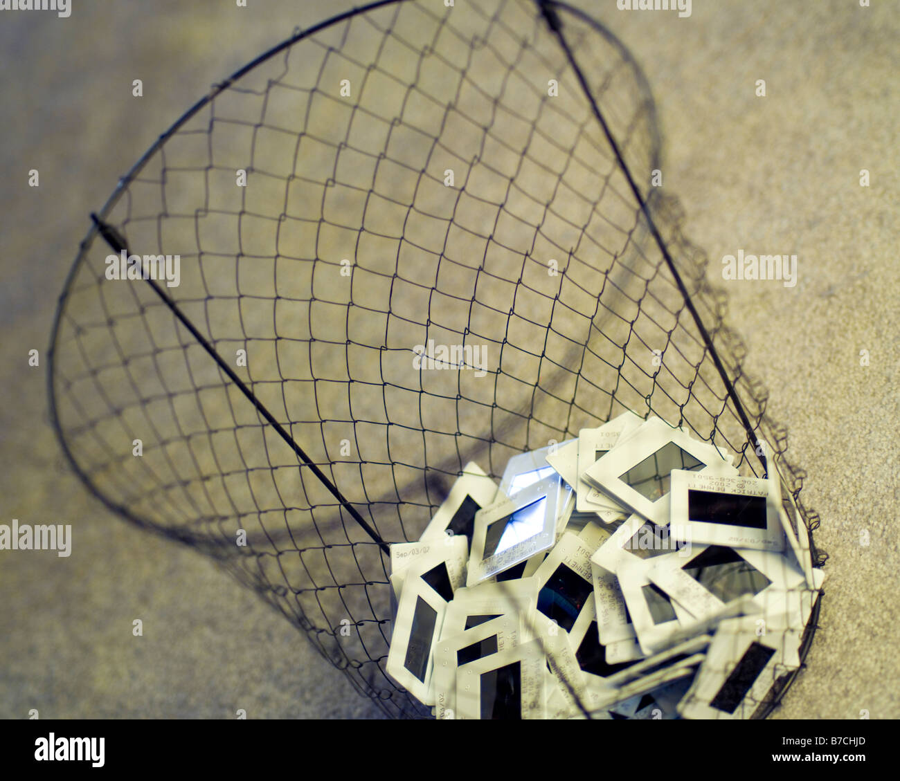 A waste basket full of slides, film being dead technology Stock Photo ...