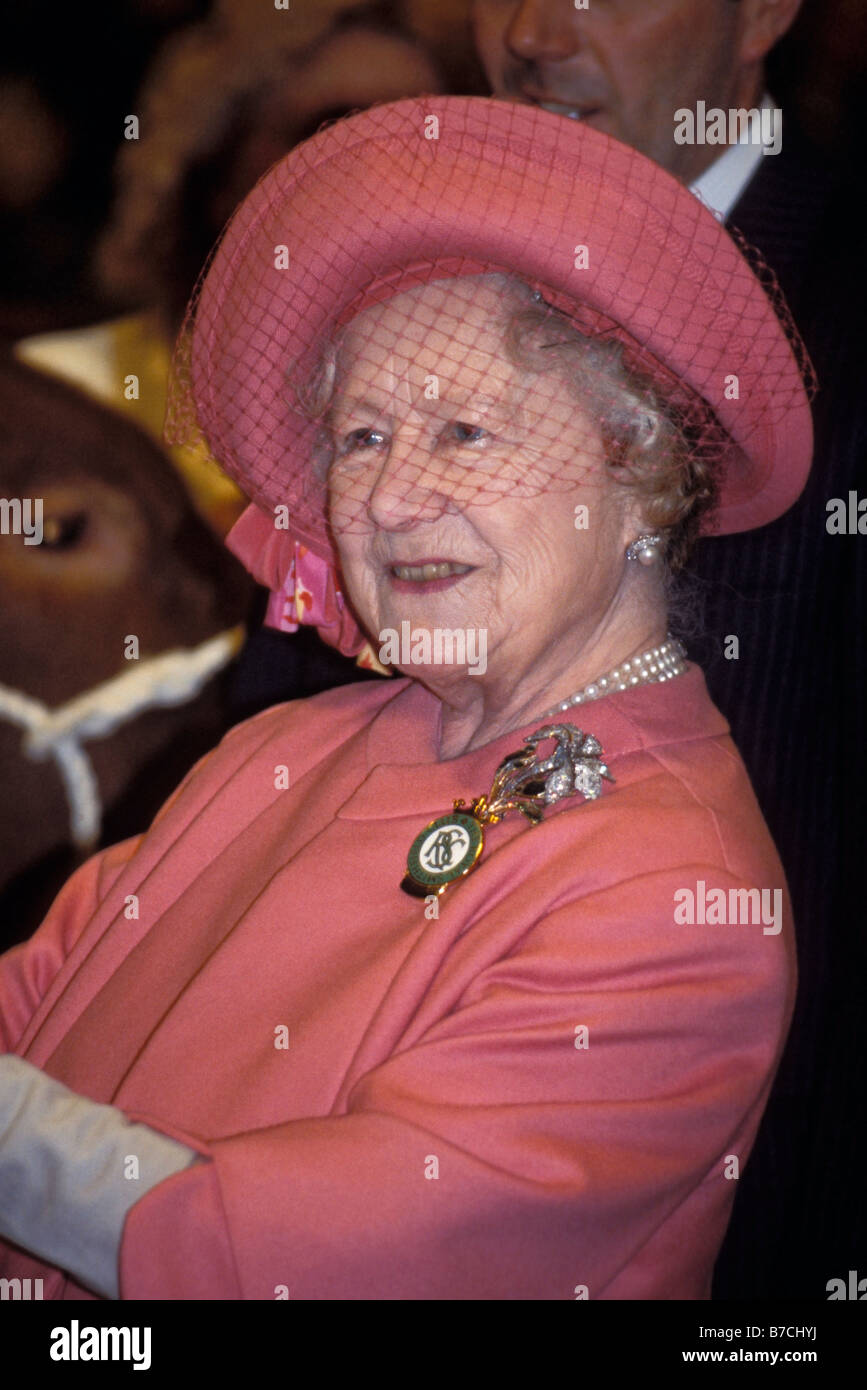 HM Queen Elizabeth the Queen Mother in a pink outfit attending the ...