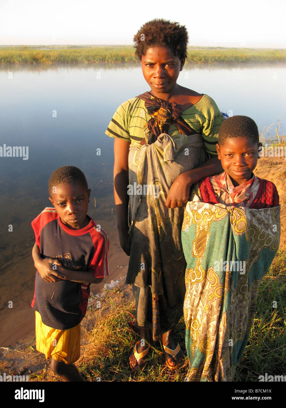 Woman of Bemba tribe with baby selling charcoal on Luapula or Congo ...
