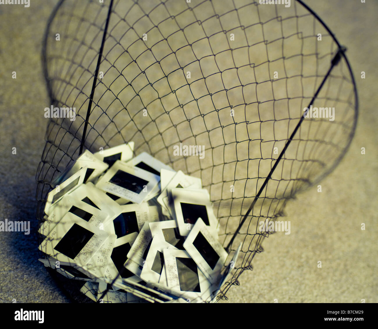 A waste basket full of slides, film being dead technology Stock Photo ...
