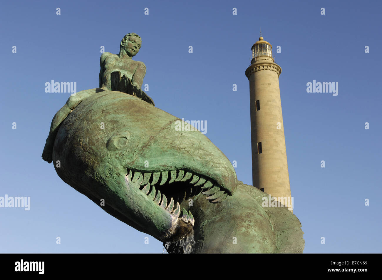 sea monster statue in front of lighthouse El Faro build in 1889 ...