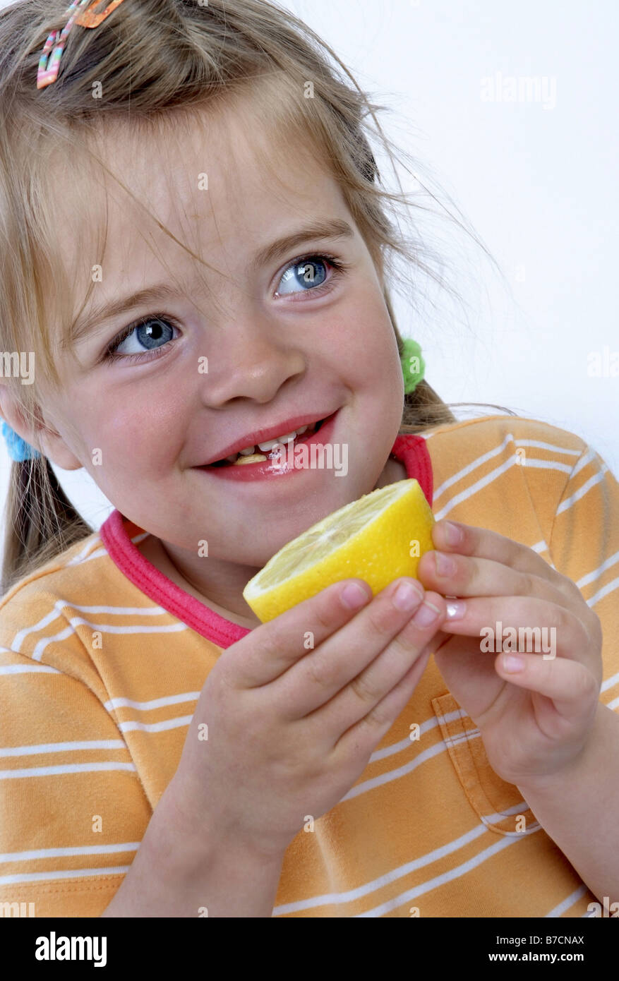 small girl with lemon Stock Photo - Alamy