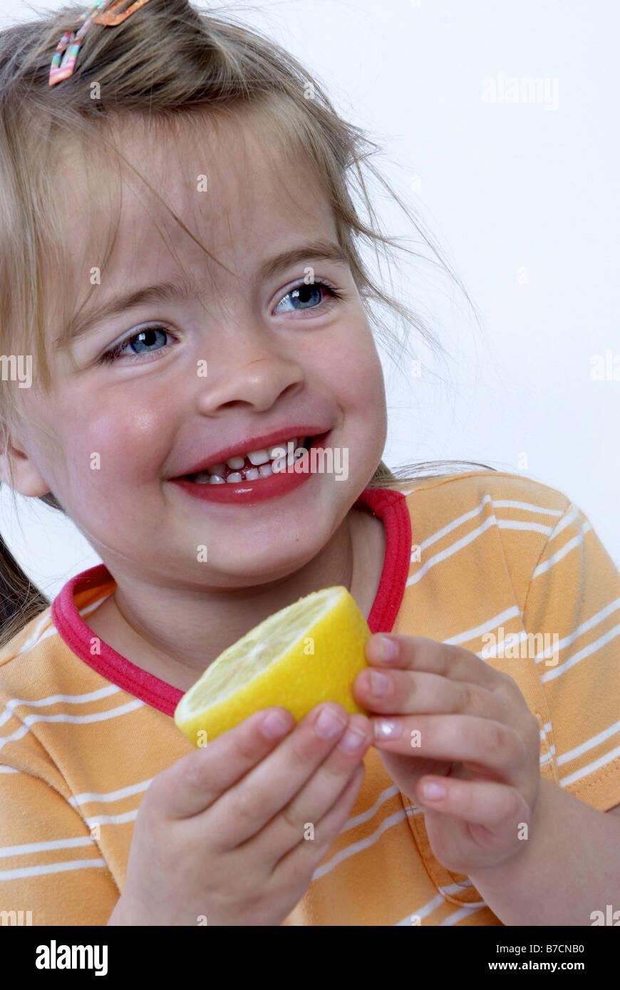 small girl with lemon Stock Photo - Alamy
