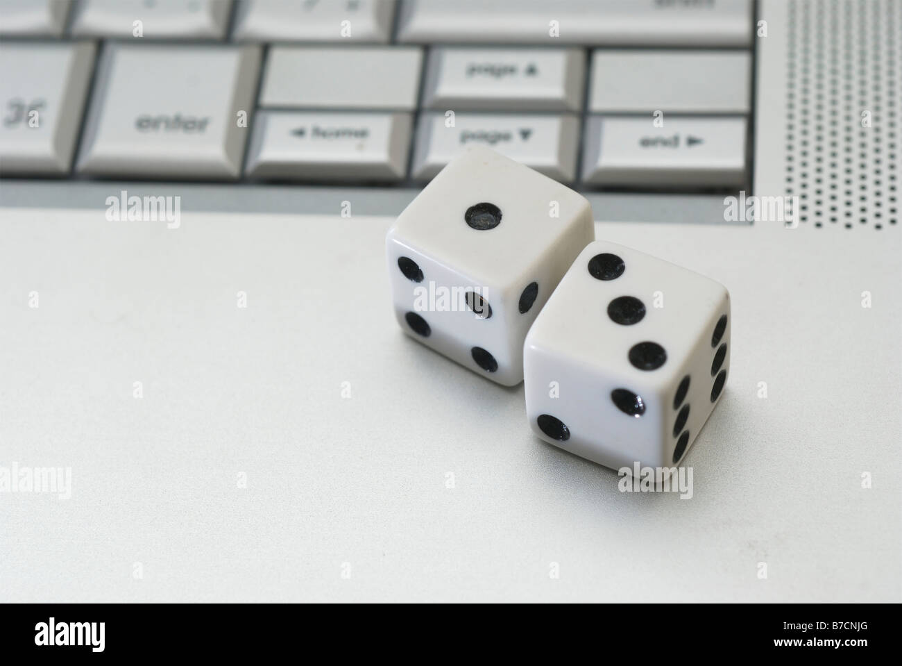 Dice on a laptop computer Stock Photo - Alamy