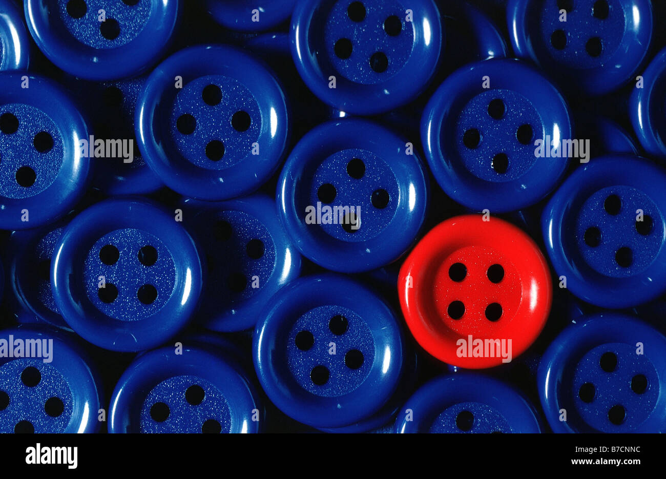 a red button under many blue Stock Photo - Alamy