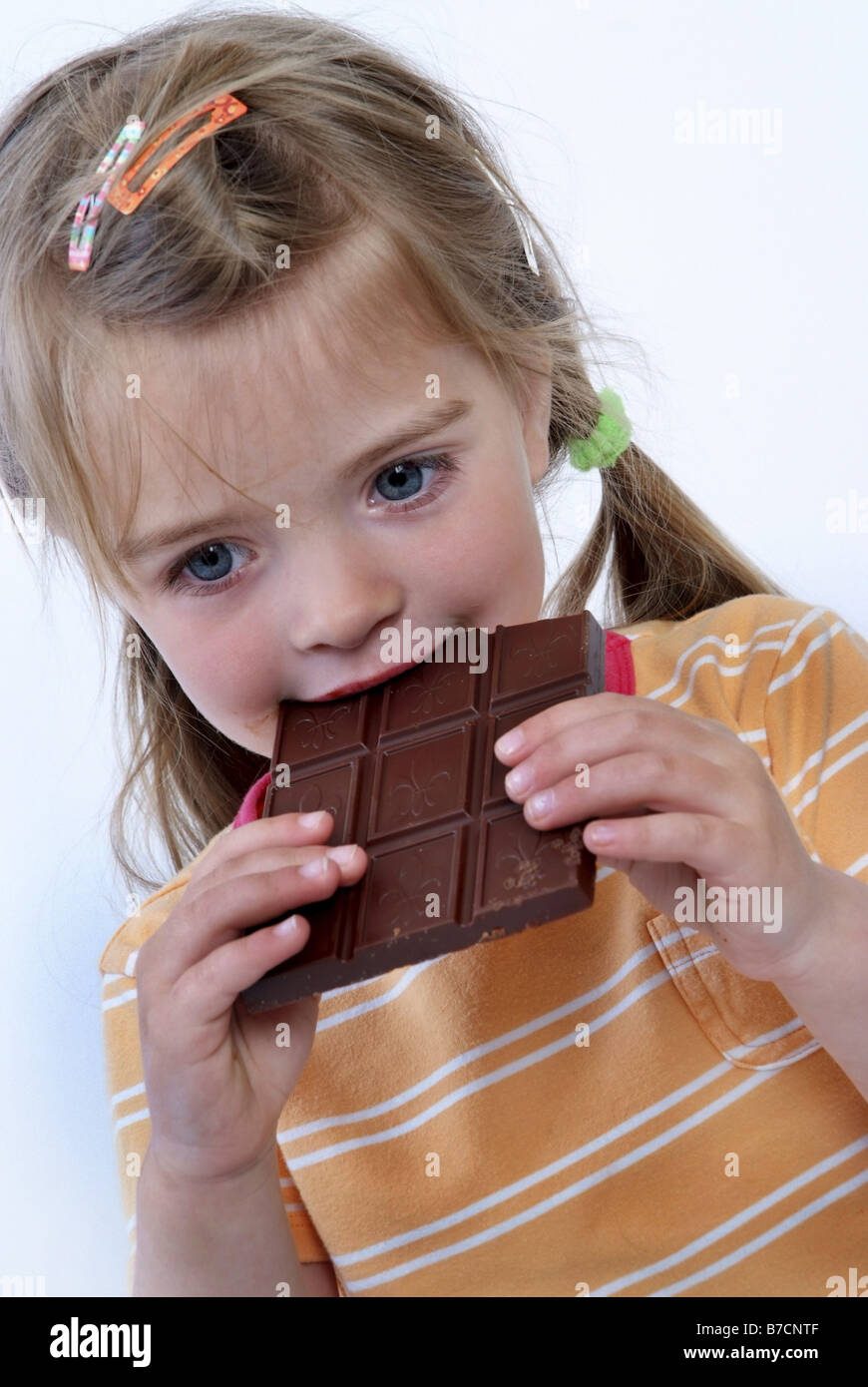 girl eating a bar of chocolate Stock Photo - Alamy