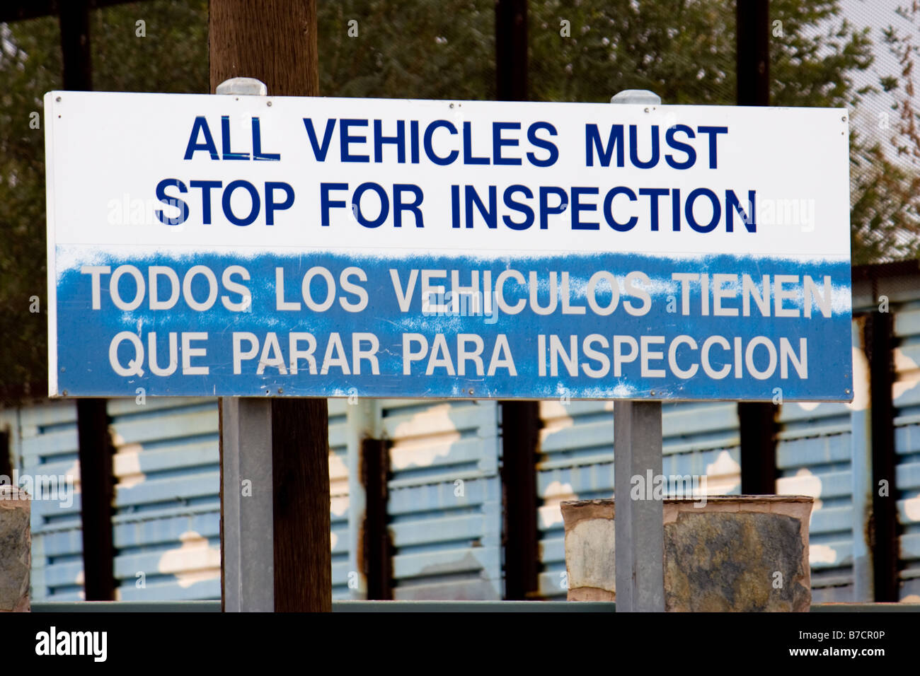 Blue and white sign at Arizona and Mexico border telling people to stop ...