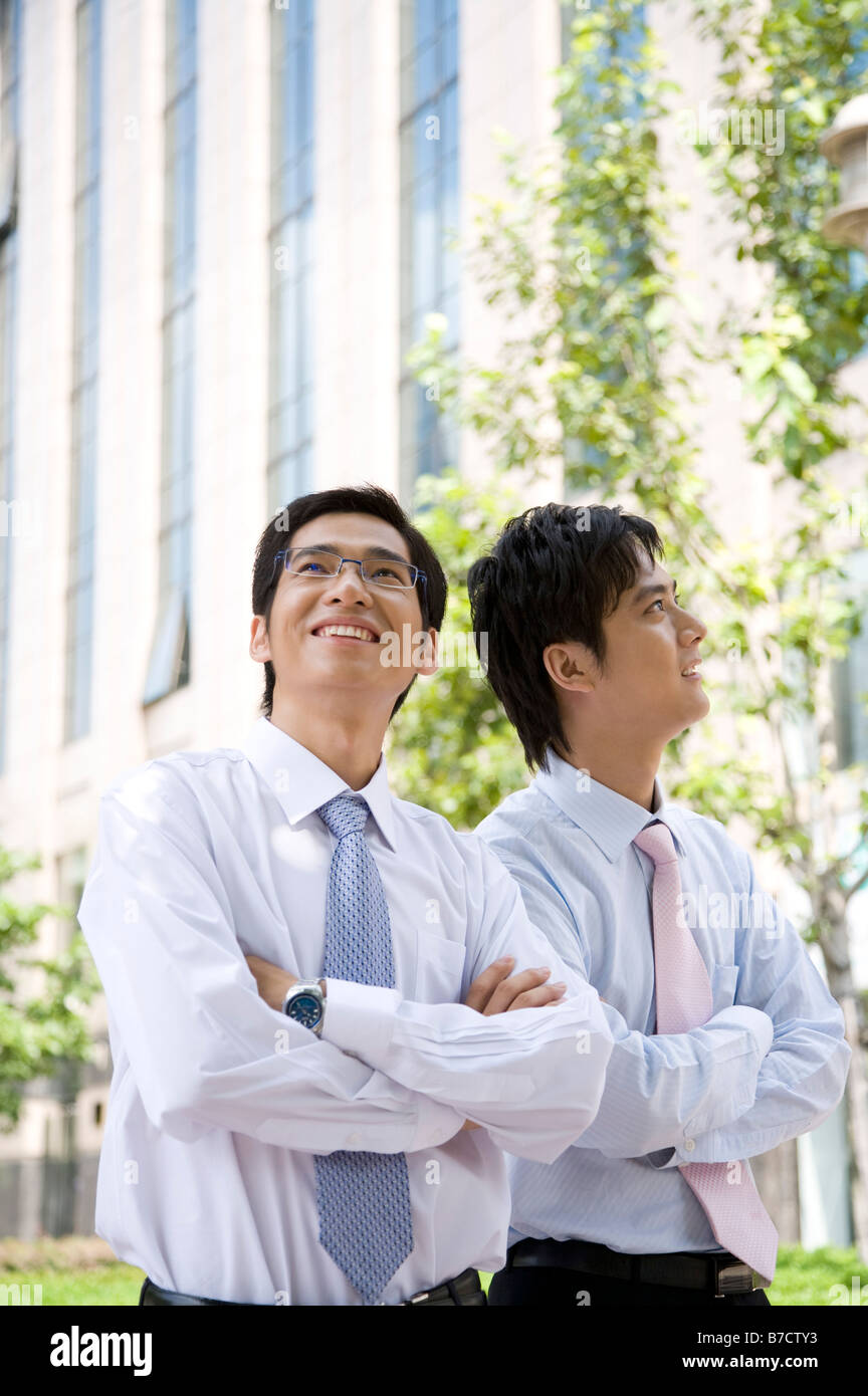 Two men standing together hi-res stock photography and images - Alamy