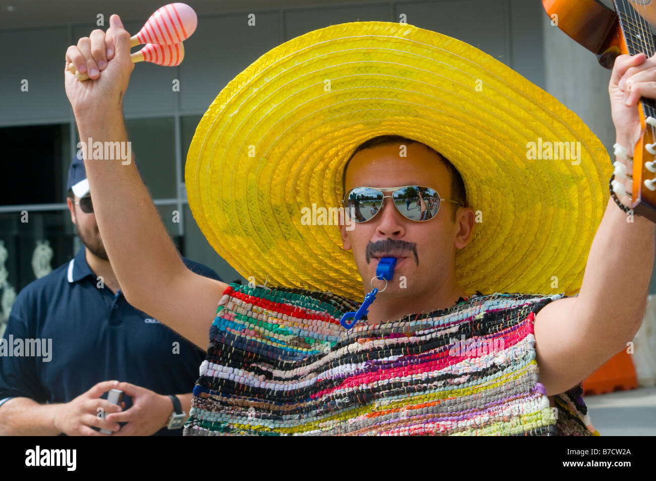 An Australian cricket fan wearing a sombrero and waving maracas ...