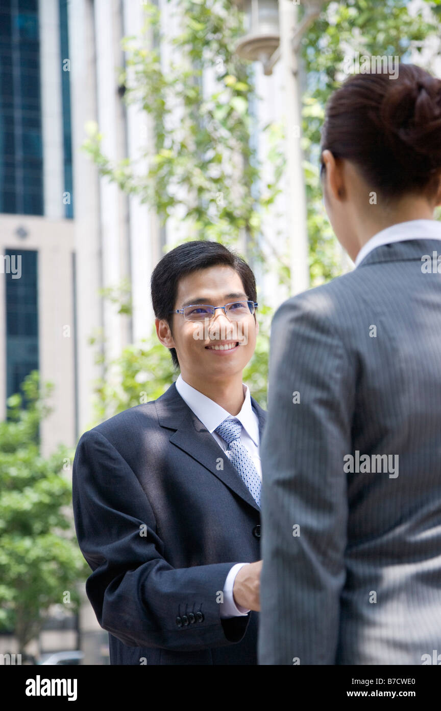 Businessman shaking tree hi-res stock photography and images - Alamy