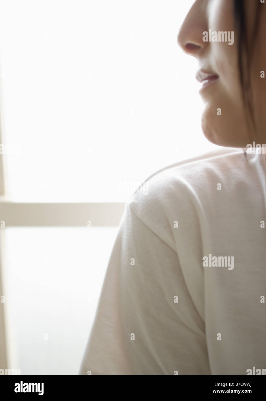 Girl by window in school uniform Stock Photo - Alamy