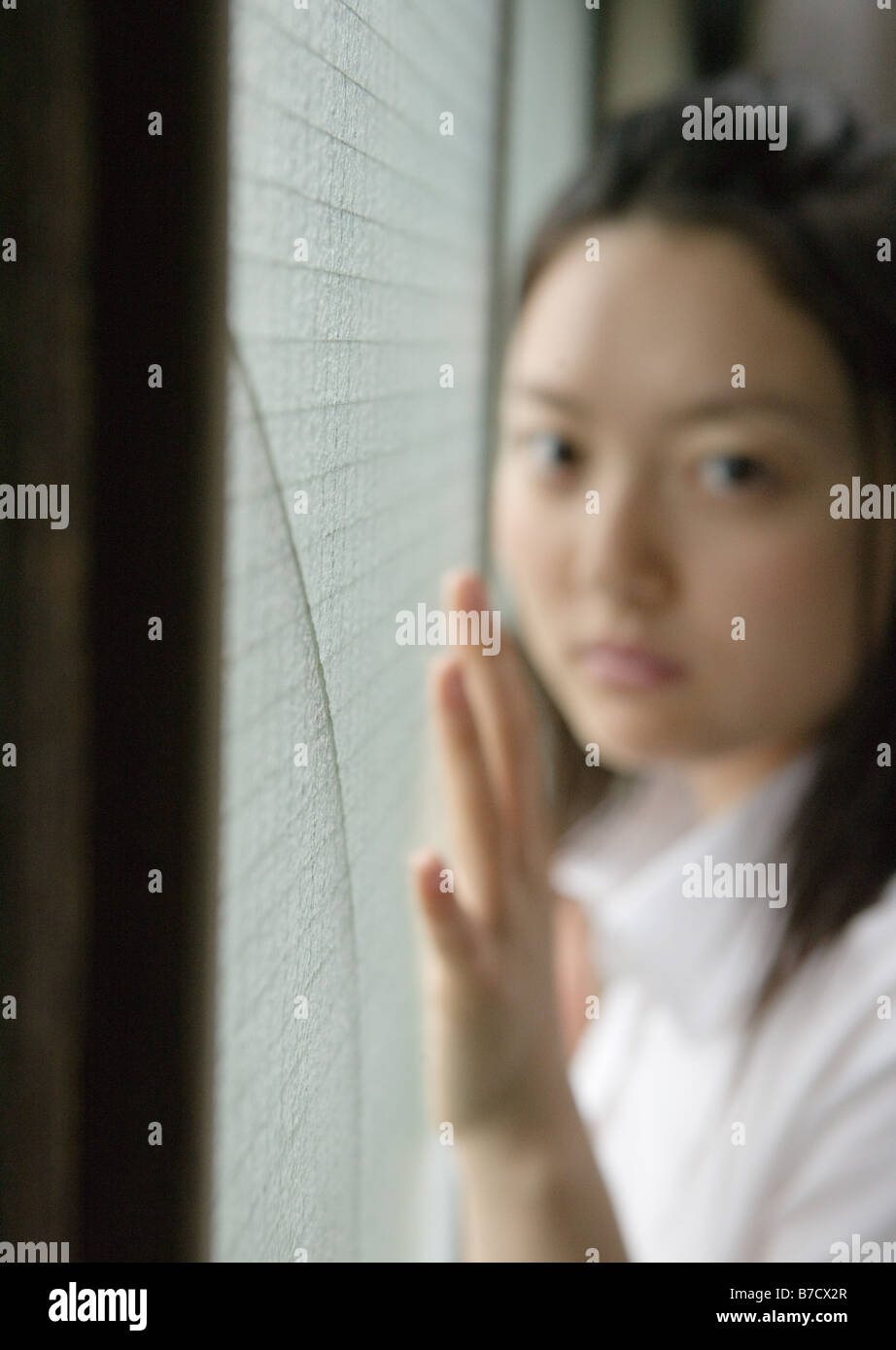 Girl by window in school uniform Stock Photo - Alamy