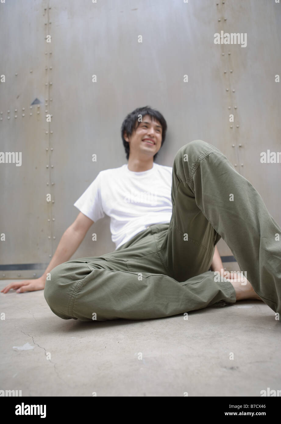 Man sitting on floor Stock Photo - Alamy