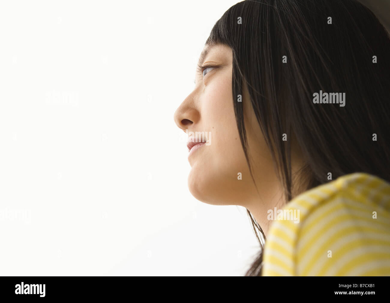 Side face of young woman Stock Photo - Alamy