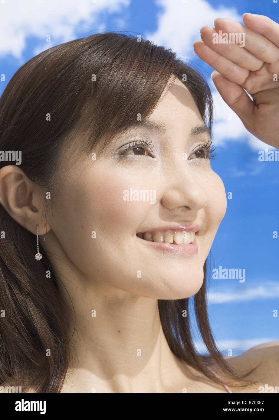 Woman and sky Stock Photo - Alamy