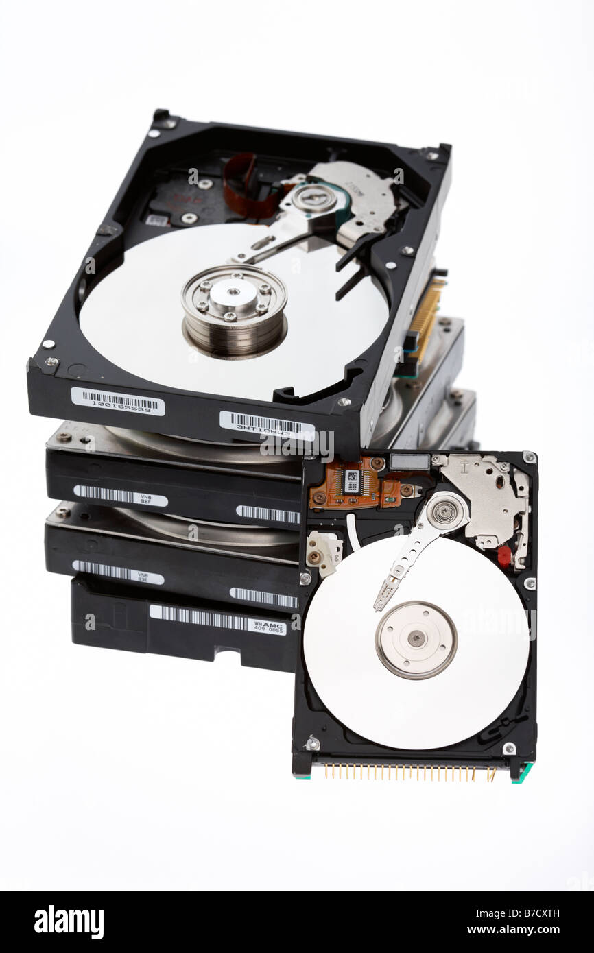 pile of opened computer hard drives on white background Stock Photo - Alamy
