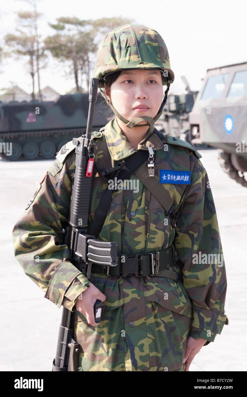 Taiwanese Soldier Holding Her Rifle Standing At Attention, 58th ...