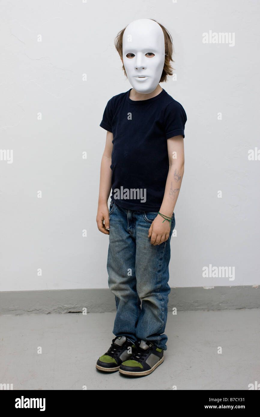 A young boy wearing a mask Stock Photo - Alamy