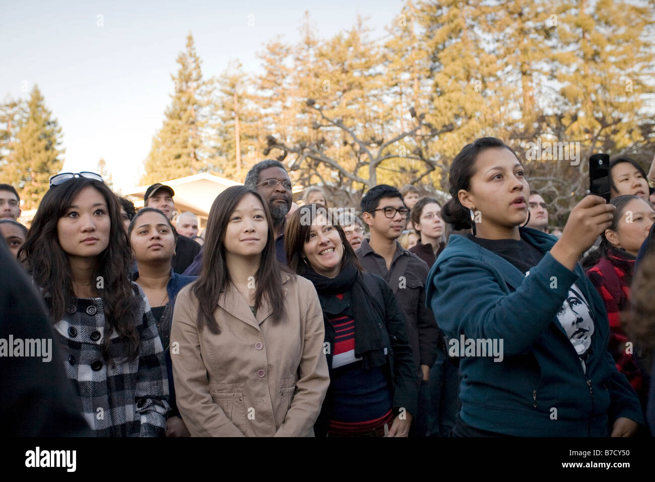 A crowd of students, faculty, staff and residents from surrounding ...