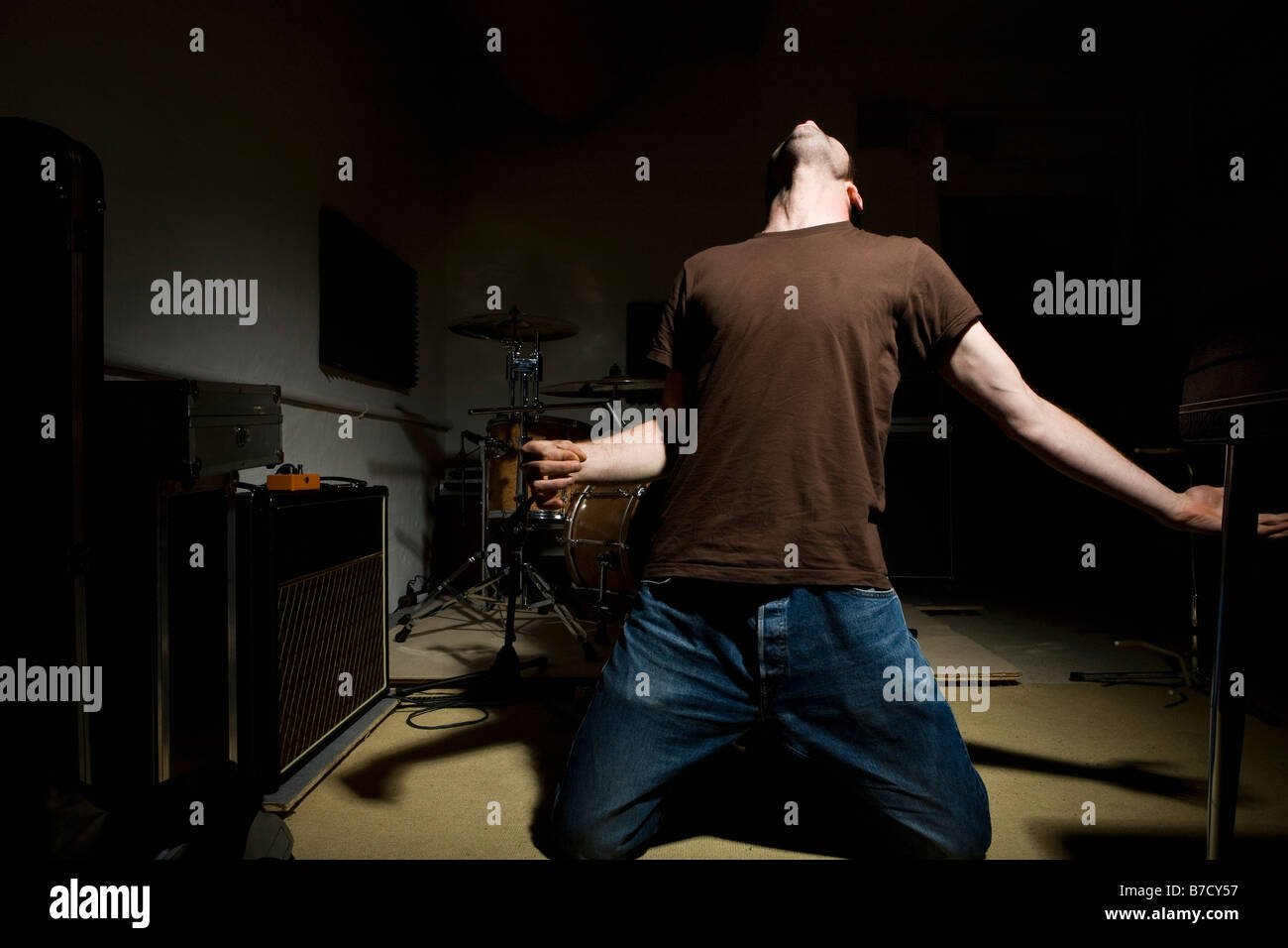 A man performing air guitar Stock Photo - Alamy