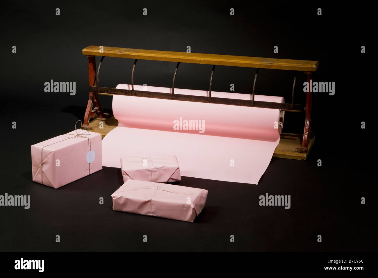 A roll of wrapping paper and gifts Stock Photo - Alamy