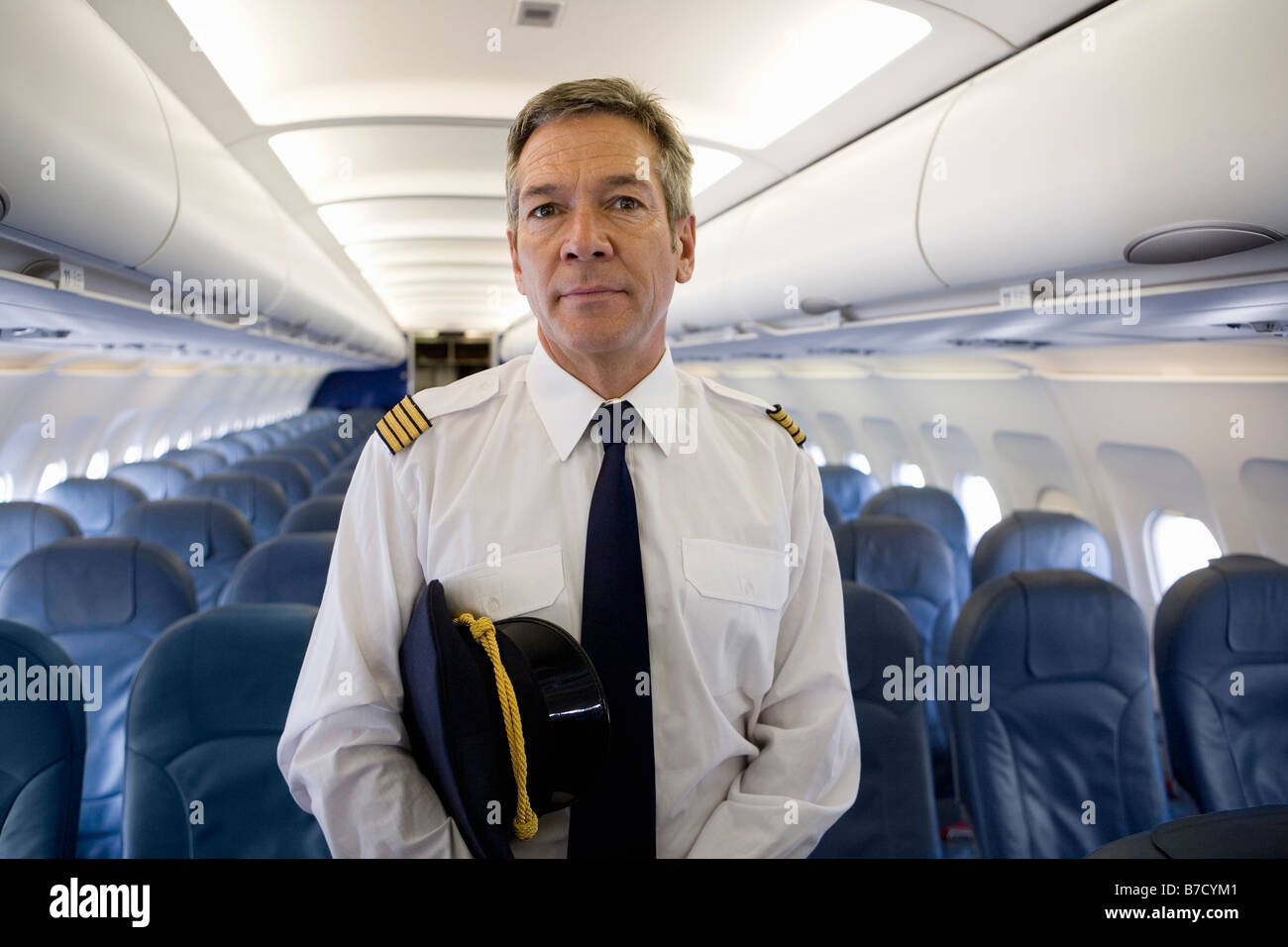 A pilot standing in the cabin of a plane Stock Photo - Alamy