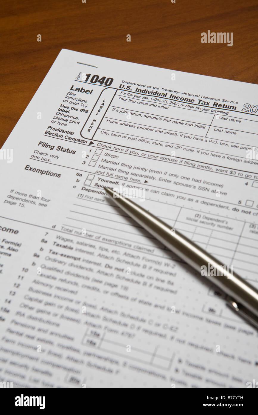 A tax form and a pen Stock Photo - Alamy