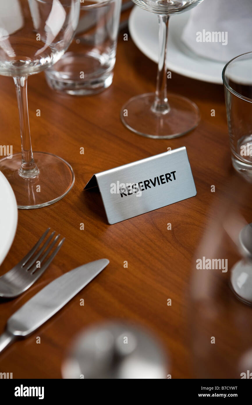 Reserved Sign on a dining table Stock Photo - Alamy