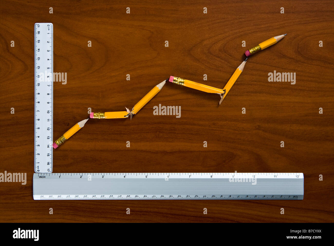 A line graph showing growth made from pencils and rulers Stock Photo ...