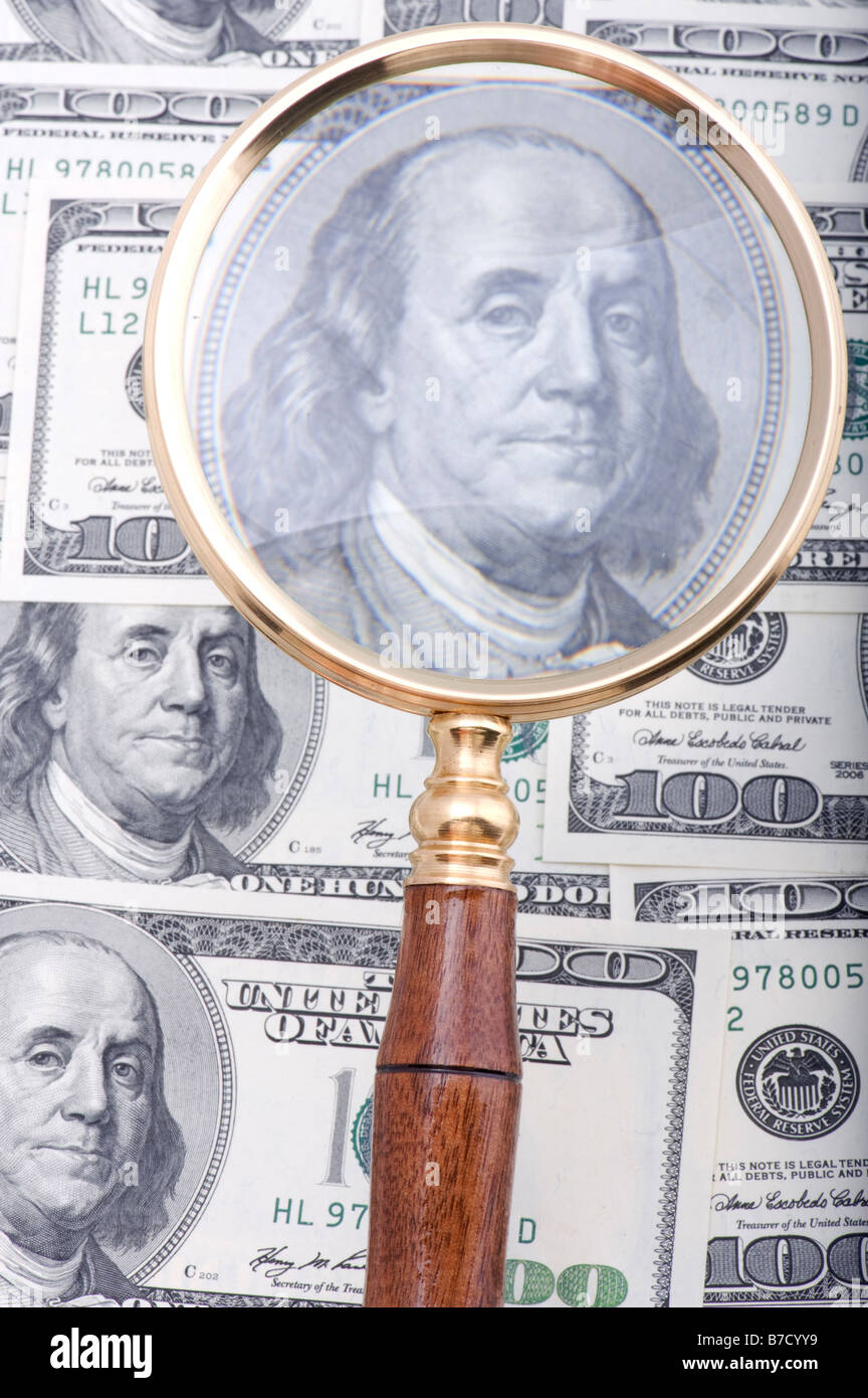 object on white currency magnifying glass with money Stock Photo - Alamy