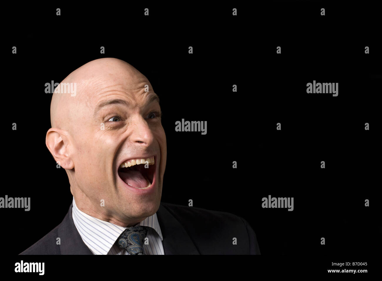A business man pulling a funny face Stock Photo - Alamy