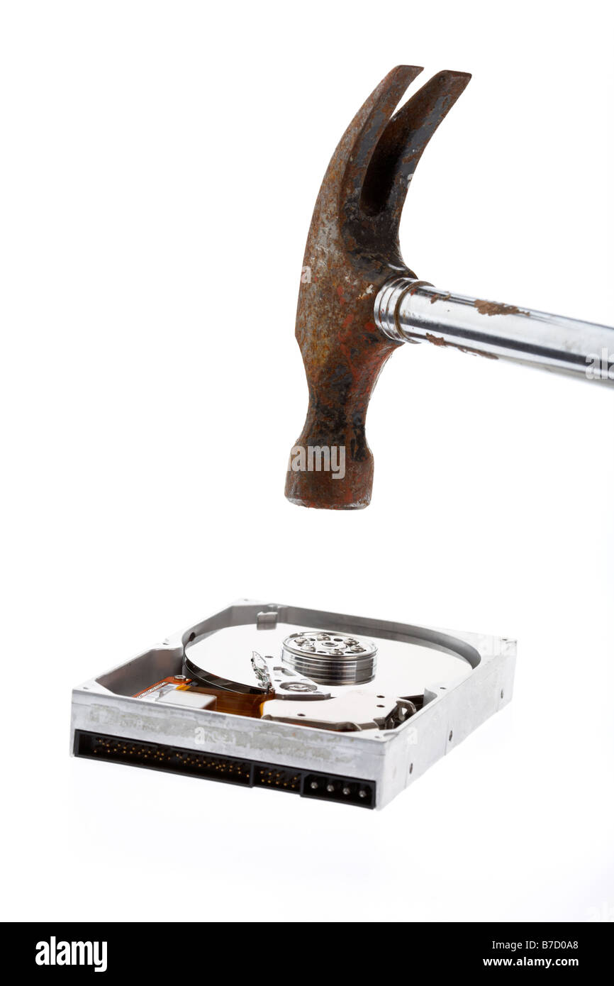 old hammer over a computer hard drive on white background Stock Photo ...