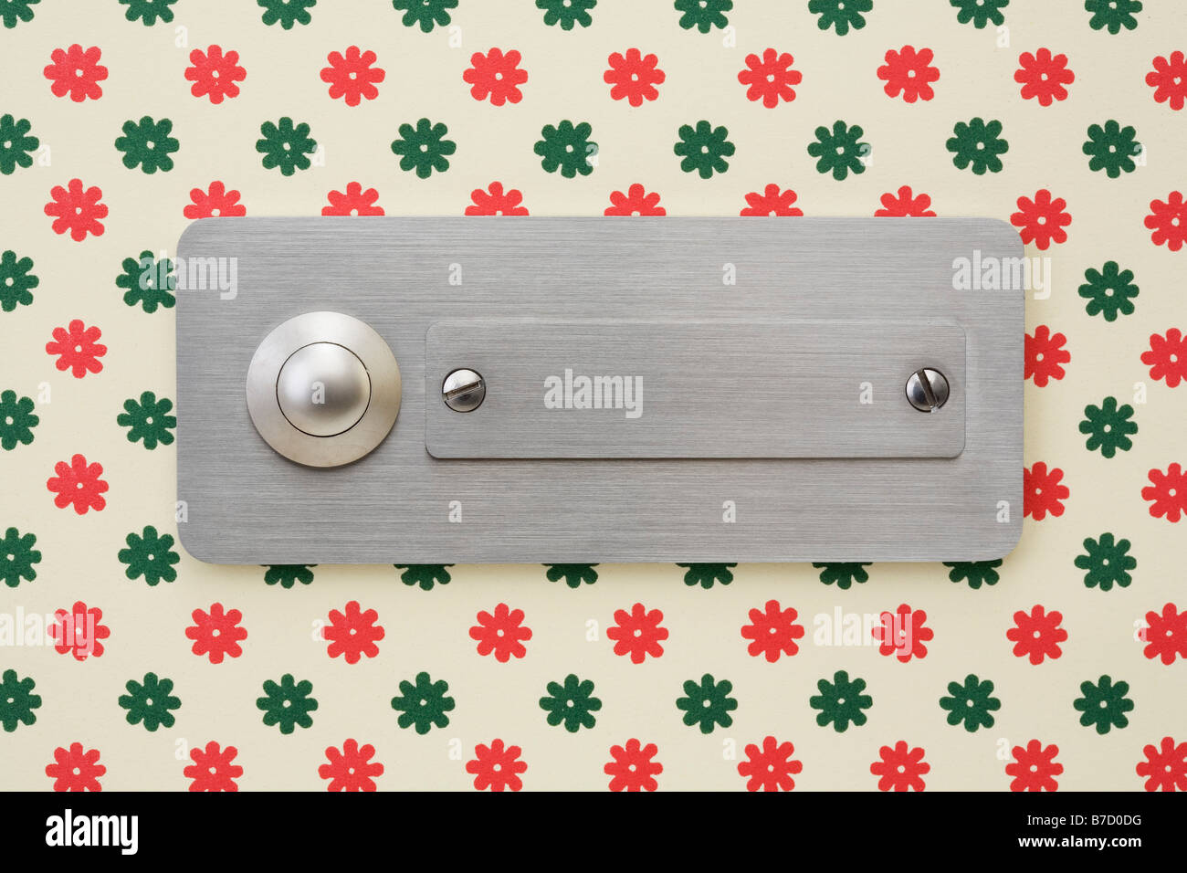 A door buzzer and name plate fixed to a wallpapered wall Stock Photo ...