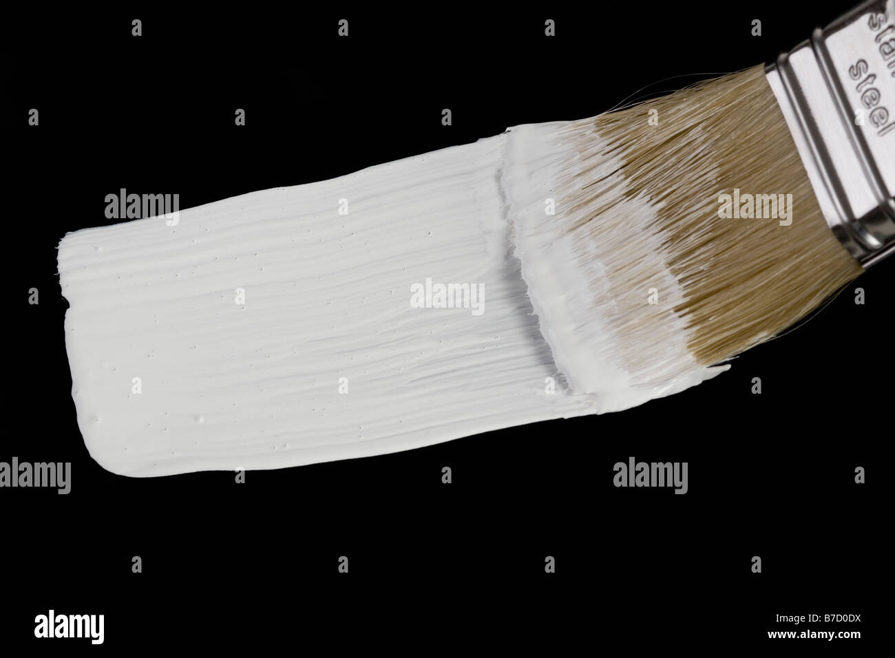 A paintbrush painting a white strip Stock Photo - Alamy