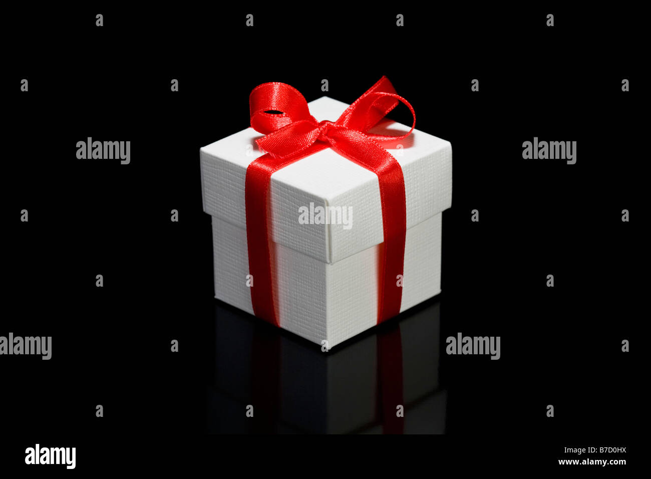 A gift box with a red ribbon Stock Photo - Alamy
