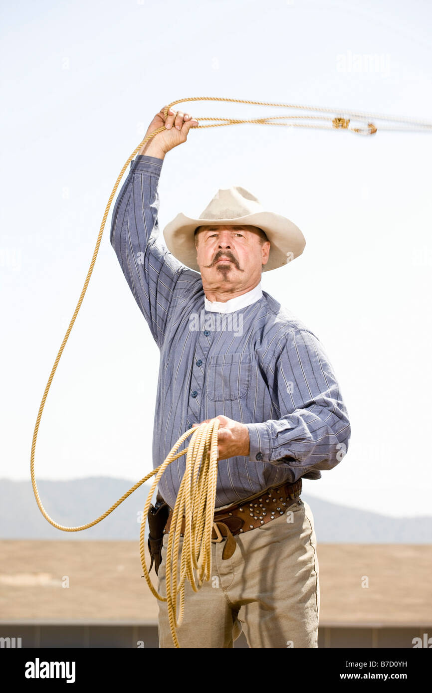 A cowboy lassoing Stock Photo - Alamy