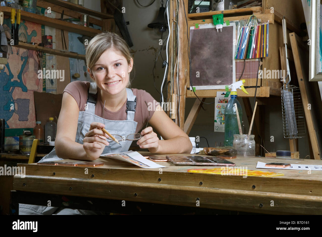 A young woman working in an art studio, portrait Stock Photo - Alamy