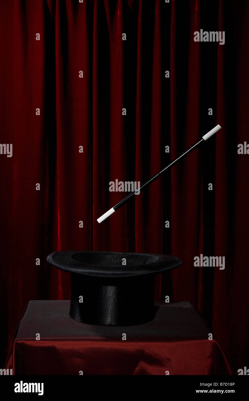 A magic wand hovering over a top hat Stock Photo - Alamy