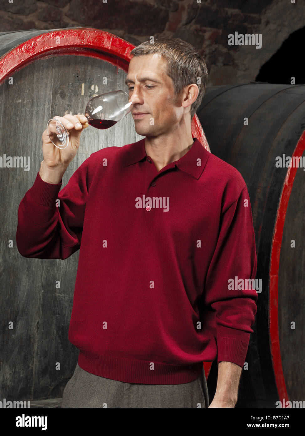 A vintner tasting a red wine Stock Photo - Alamy