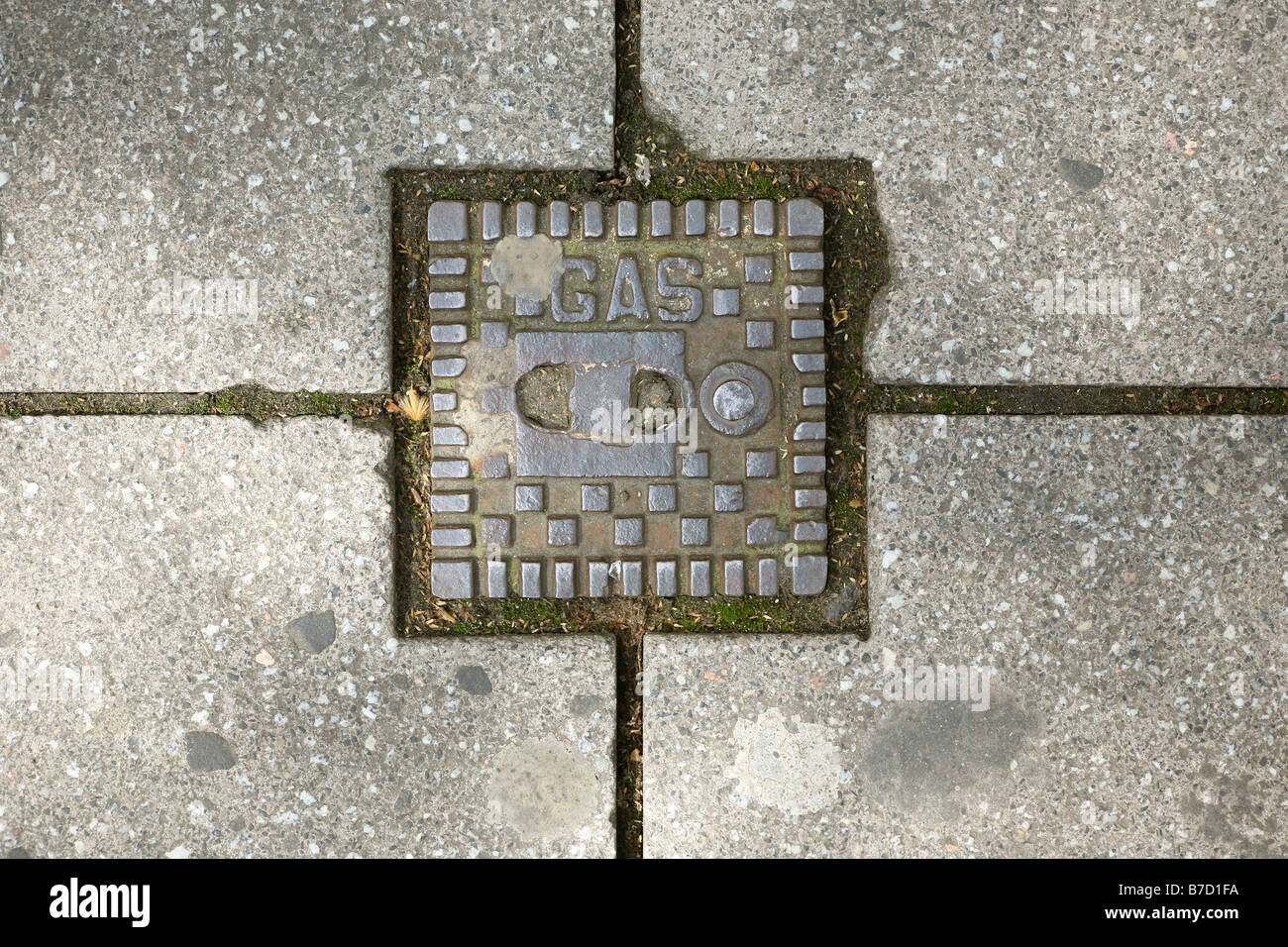 Gas main on a pavement Stock Photo - Alamy