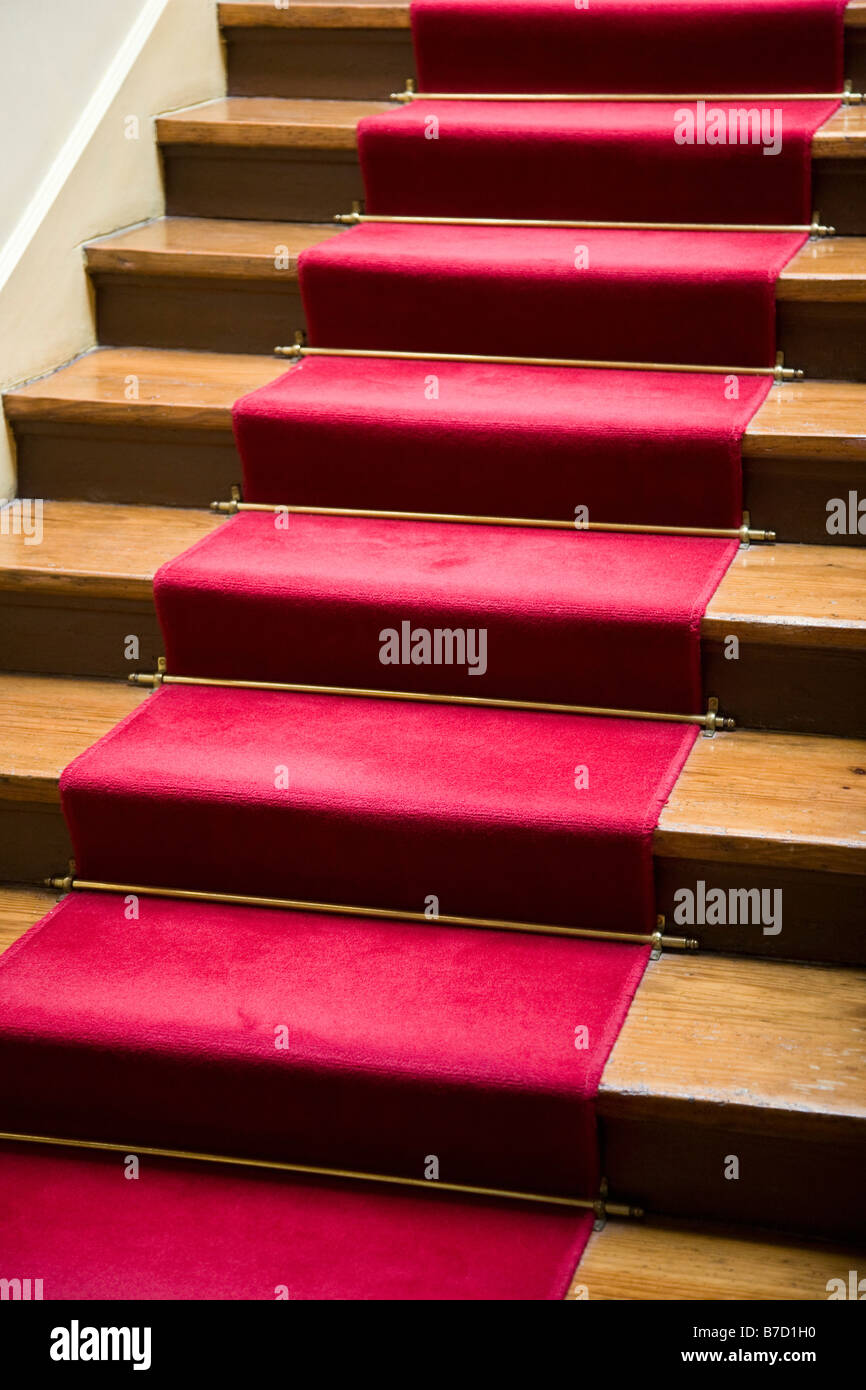 A red carpet on a staircase Stock Photo - Alamy