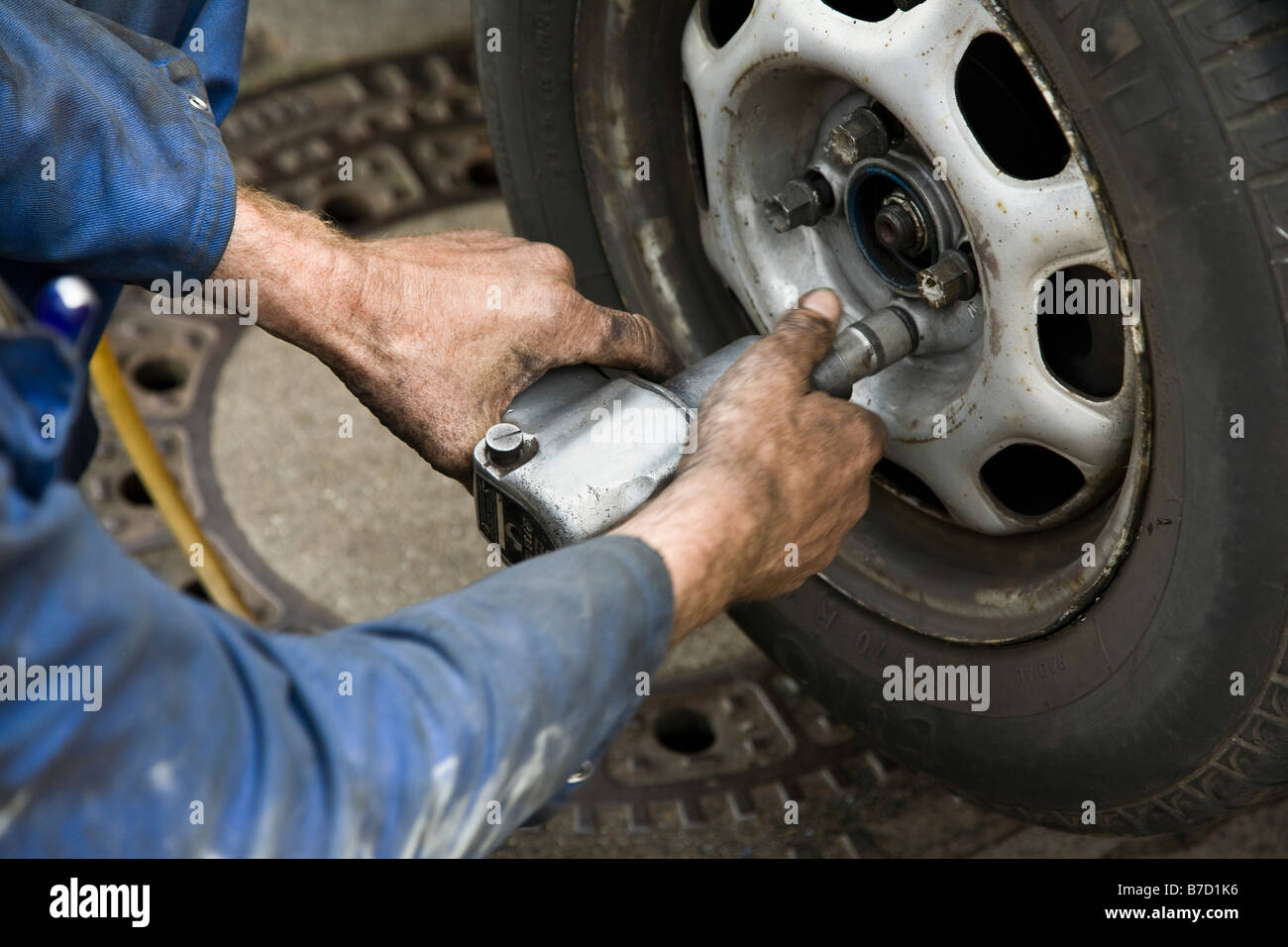 Mechanic unscrewing hi-res stock photography and images - Alamy