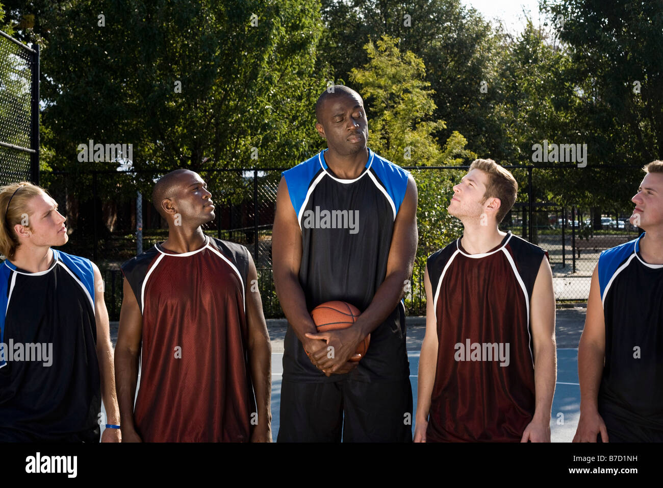 Five basketball players in a line Stock Photo - Alamy
