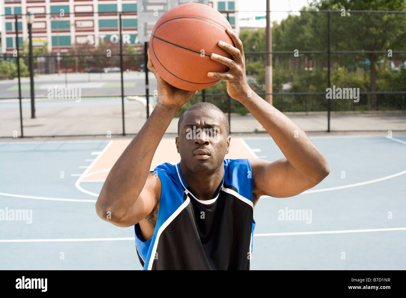 A man preparing to shoot a basketball Stock Photo - Alamy