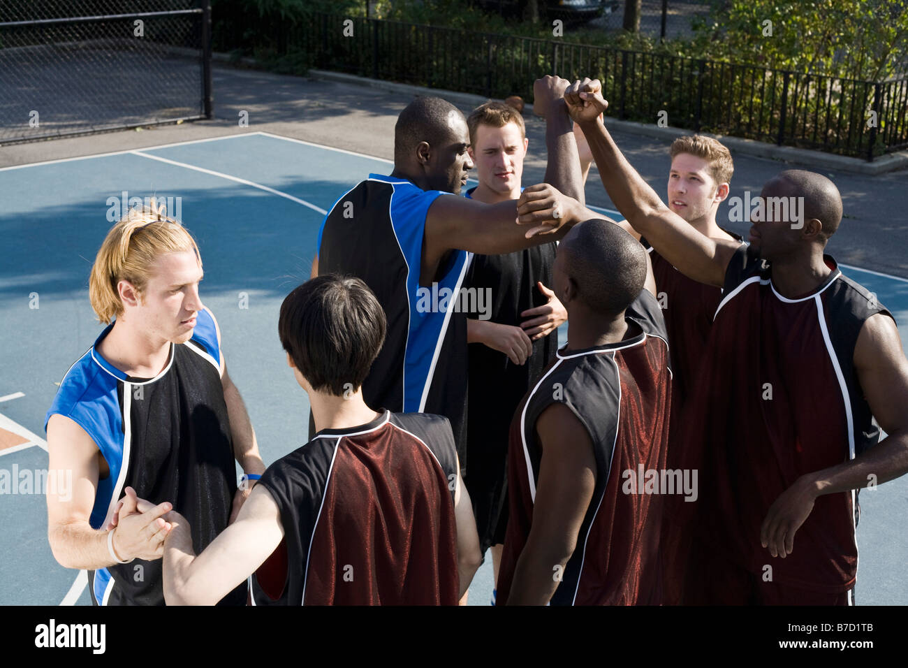 Two teams of basketball players shaking hands Stock Photo - Alamy